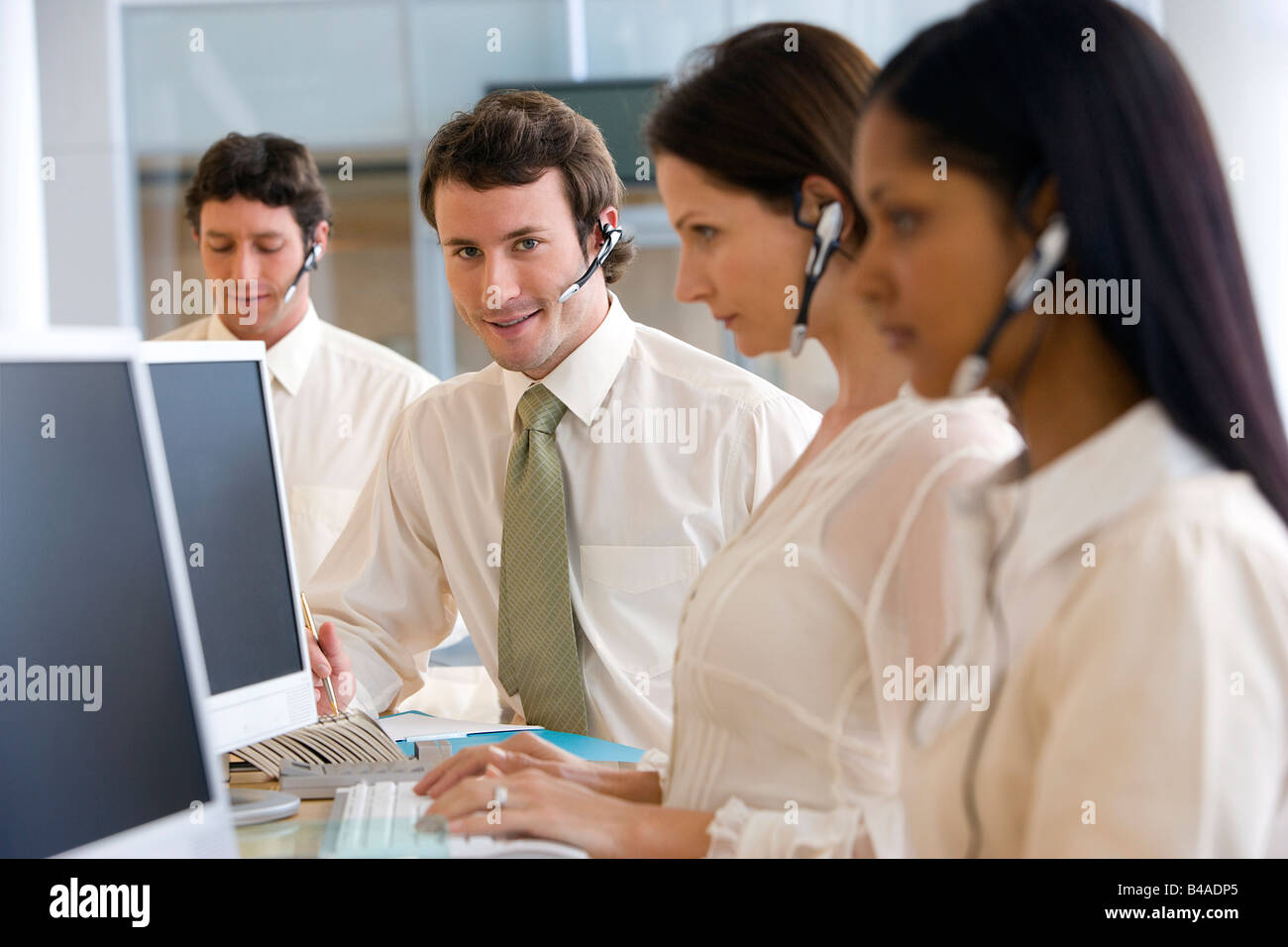 Call center with smiling man Stock Photo - Alamy