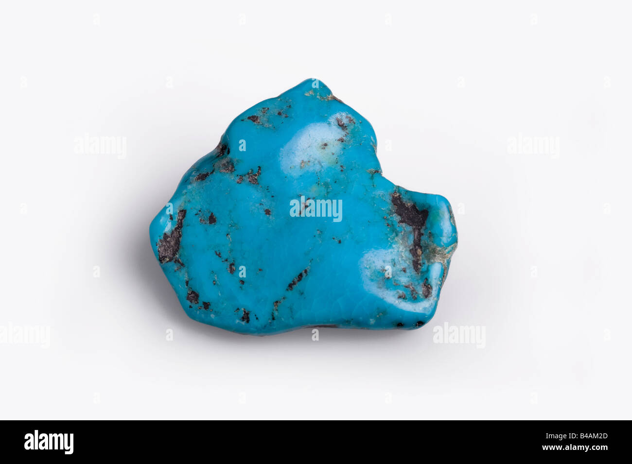 Turquoise gemstone piece on white background Stock Photo - Alamy