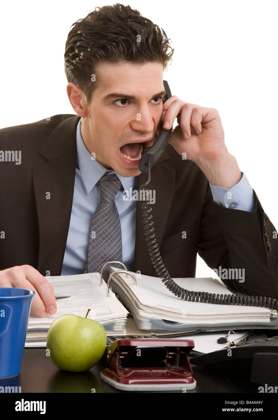 young manager crying into the telephone Stock Photo - Alamy