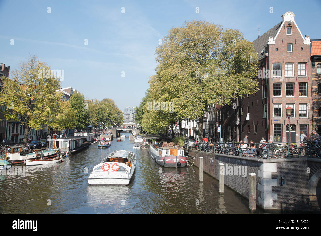 Canal and boat, Amsterdam, Netherlands Stock Photo - Alamy