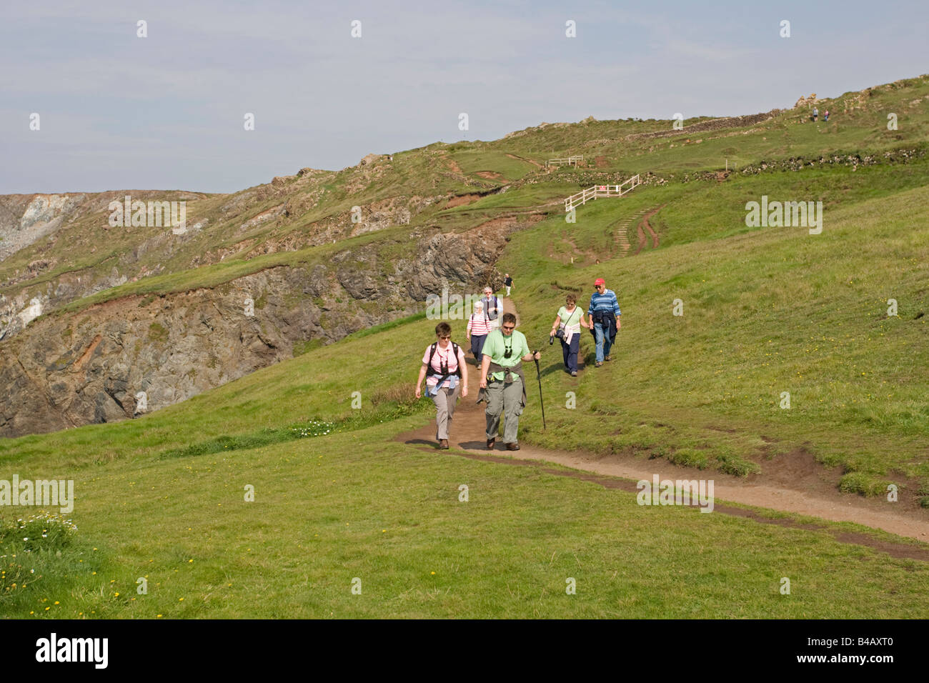 Walkers on cliff path Walkers on cliff path Caerthillian National ...