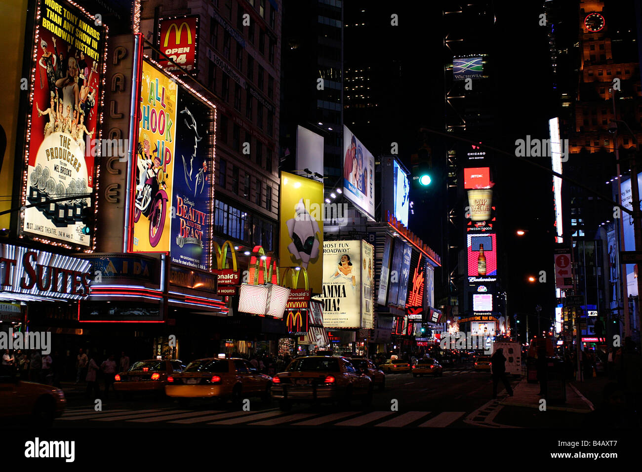 Night time in Times Square showing the bright lights of the advertising ...