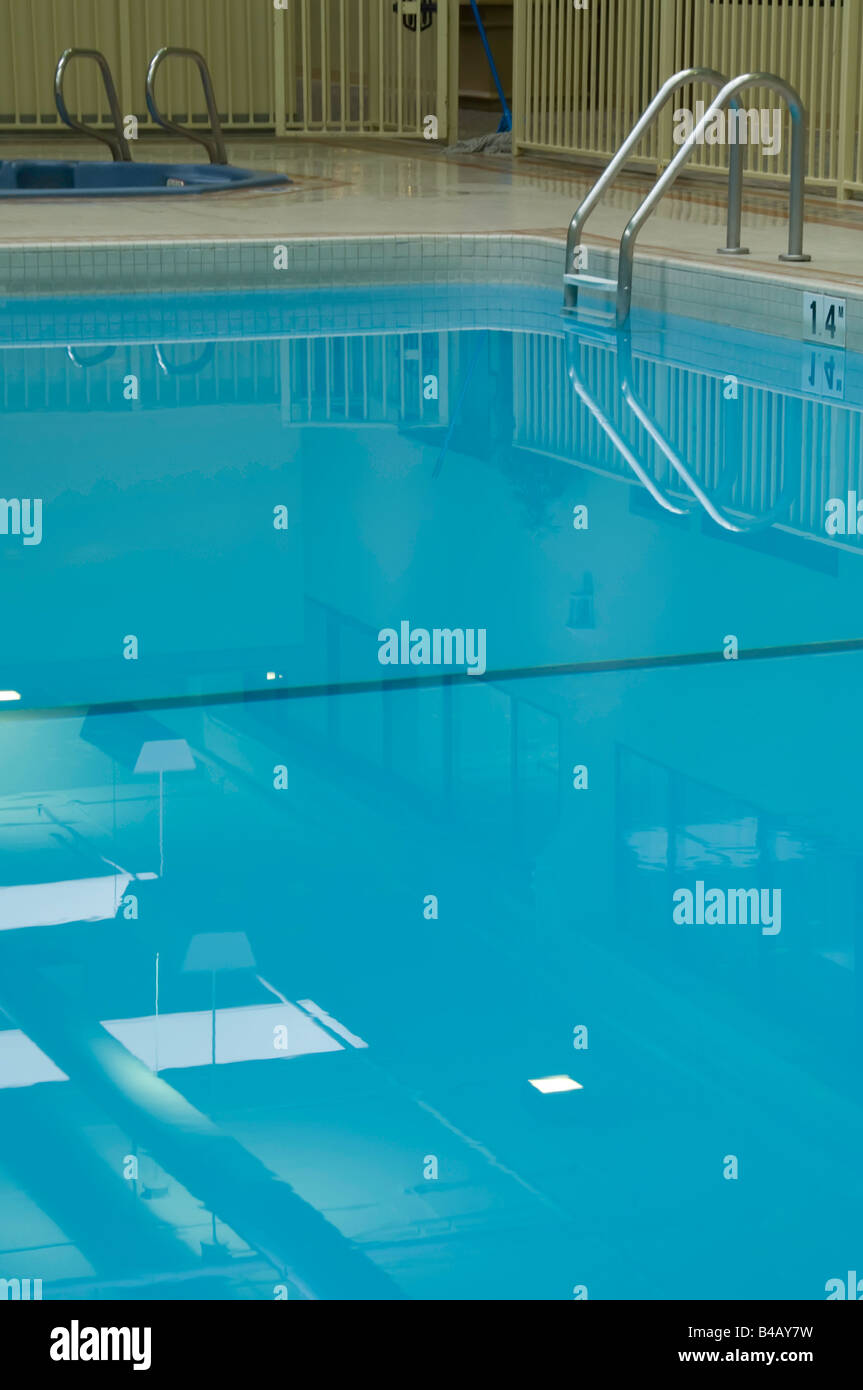 Portion of indoor swimming pool with wall and ceiling reflections Stock ...