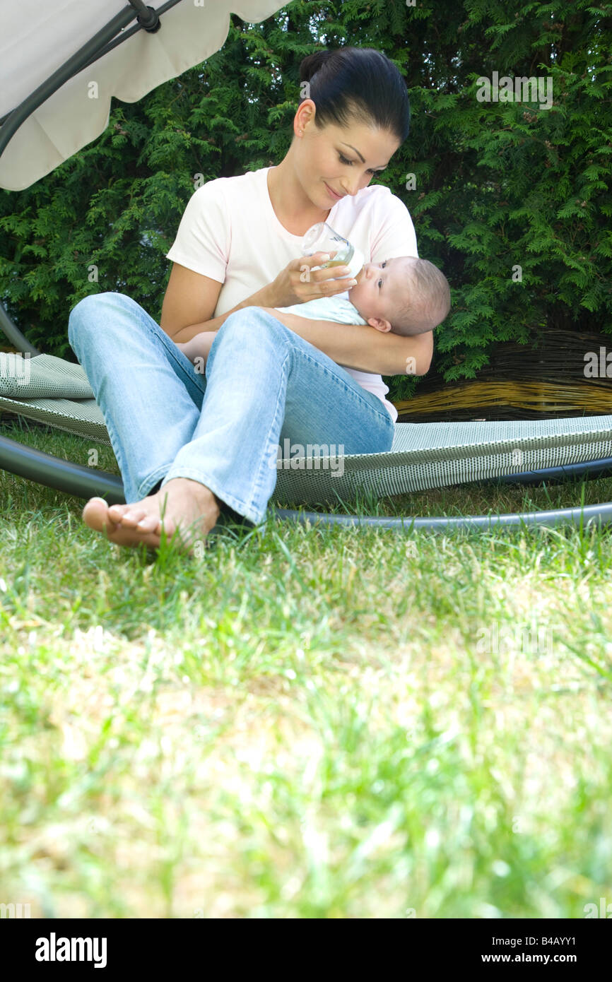 Woman being feed baby hi-res stock photography and images - Alamy