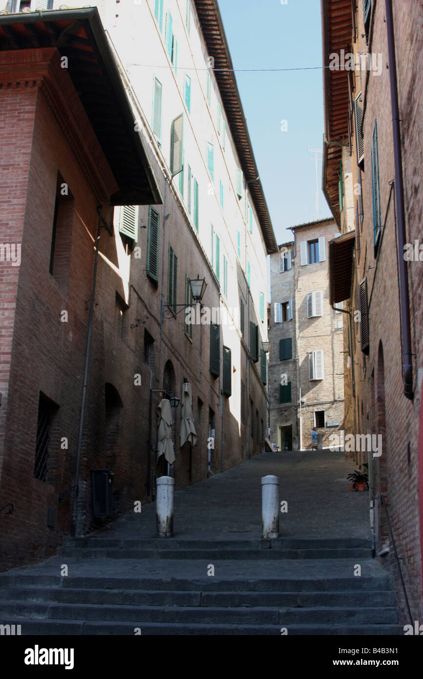 Narrow street of Siena Stock Photo - Alamy