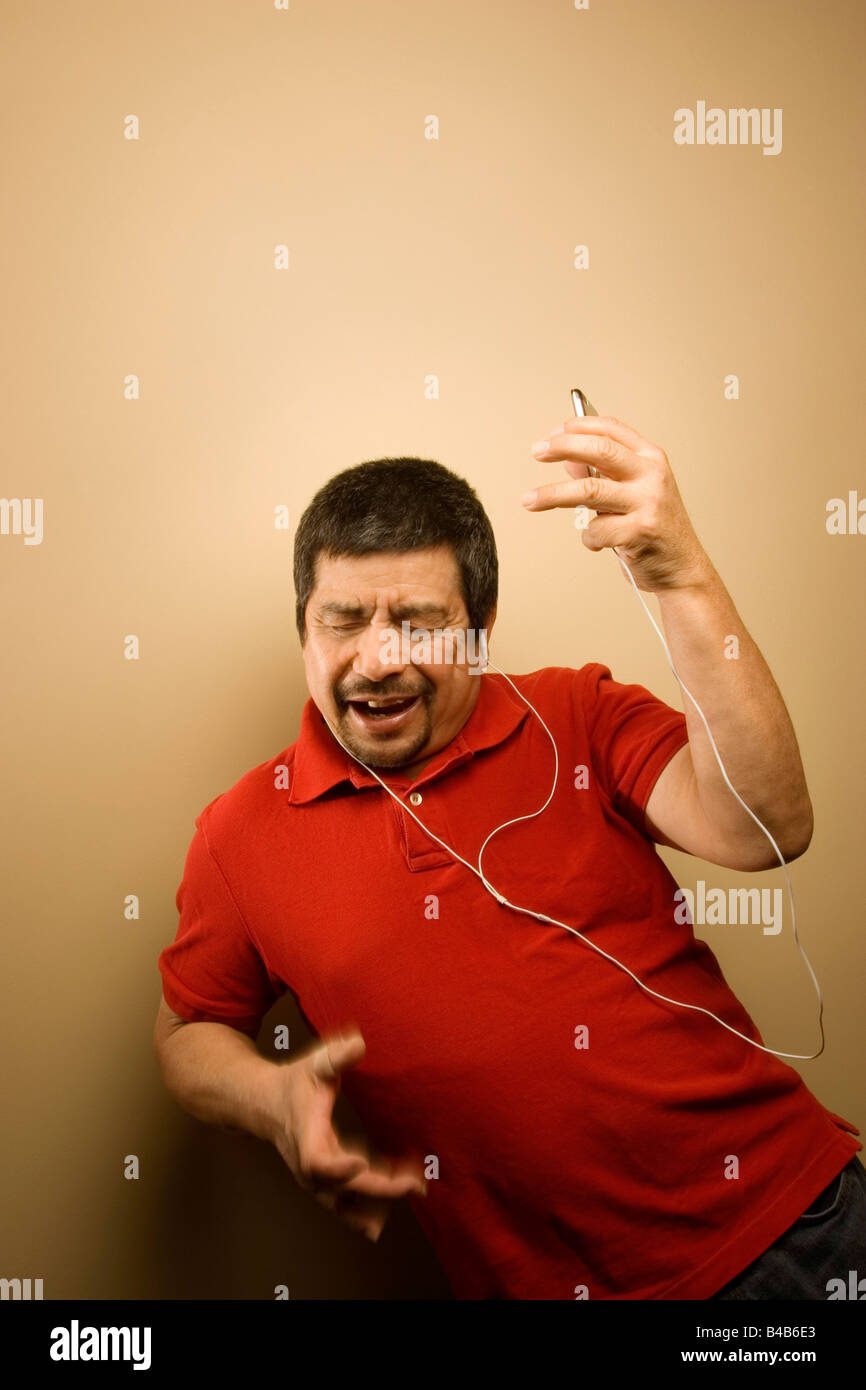 Man listening to music player Stock Photo - Alamy