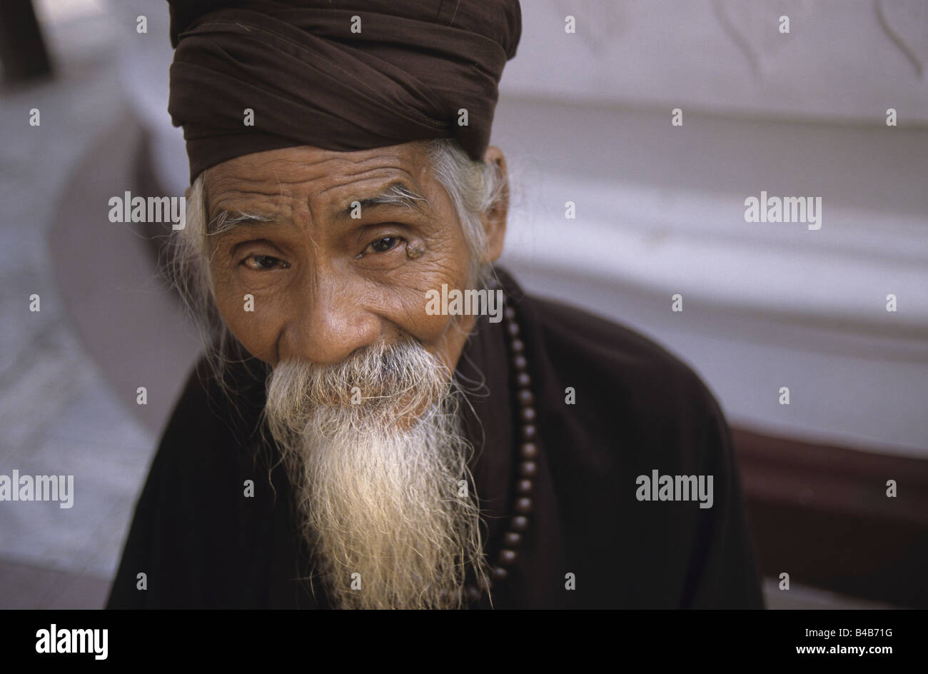 Old asian man beard wisdom hi-res stock photography and images - Alamy