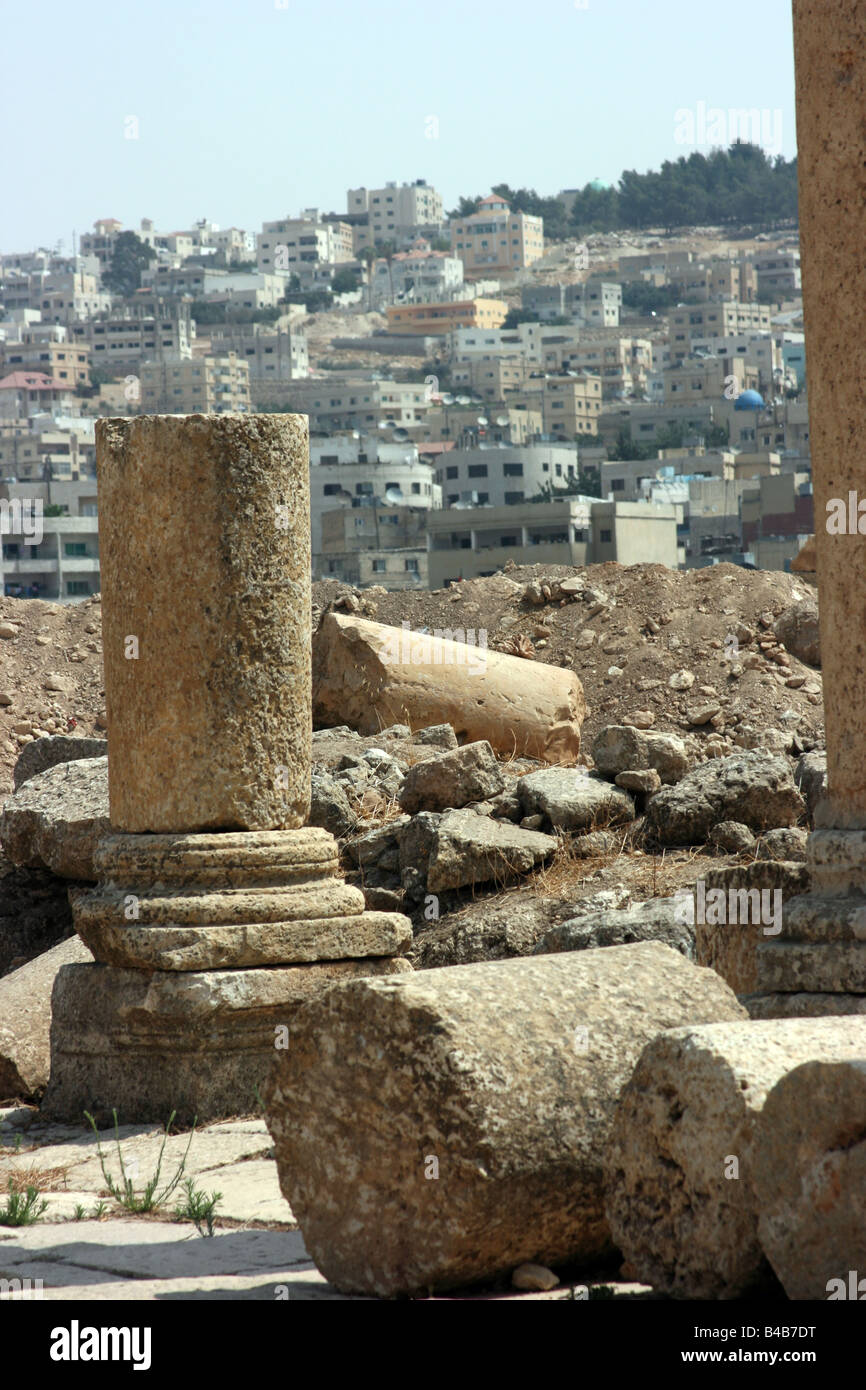 Ancient column and modern city, Jerash, Jordan Stock Photo - Alamy