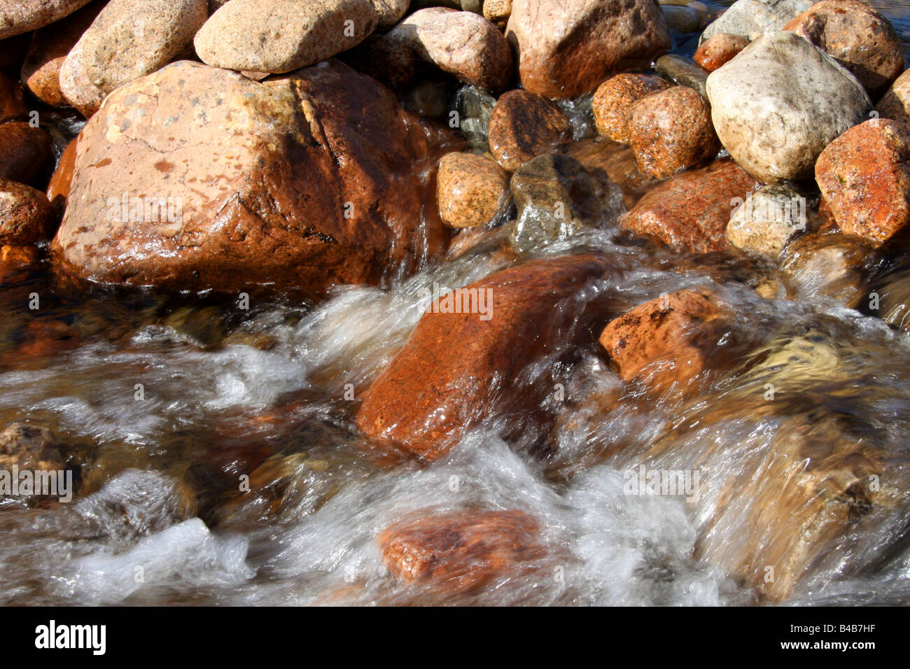 Water flowing over pebbles hi-res stock photography and images - Alamy