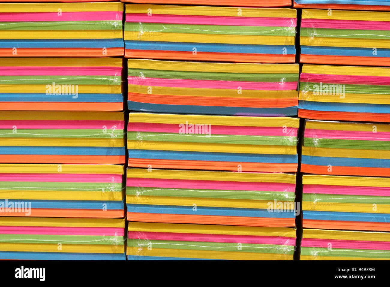 Stacks of multi colored paper pads in a retail store Stock Photo - Alamy