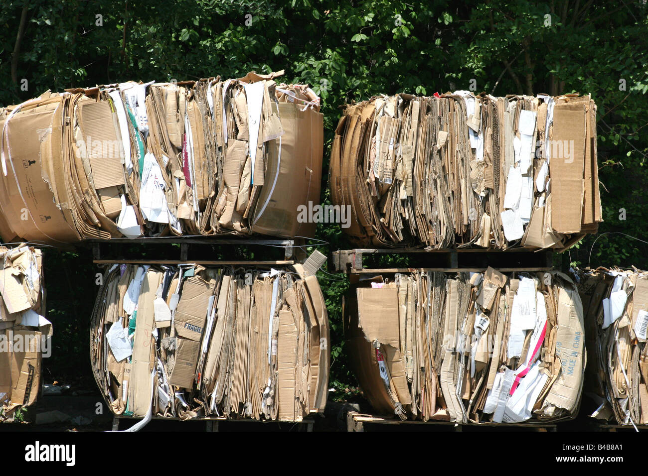 Bundles of cardboard for recycling Stock Photo - Alamy