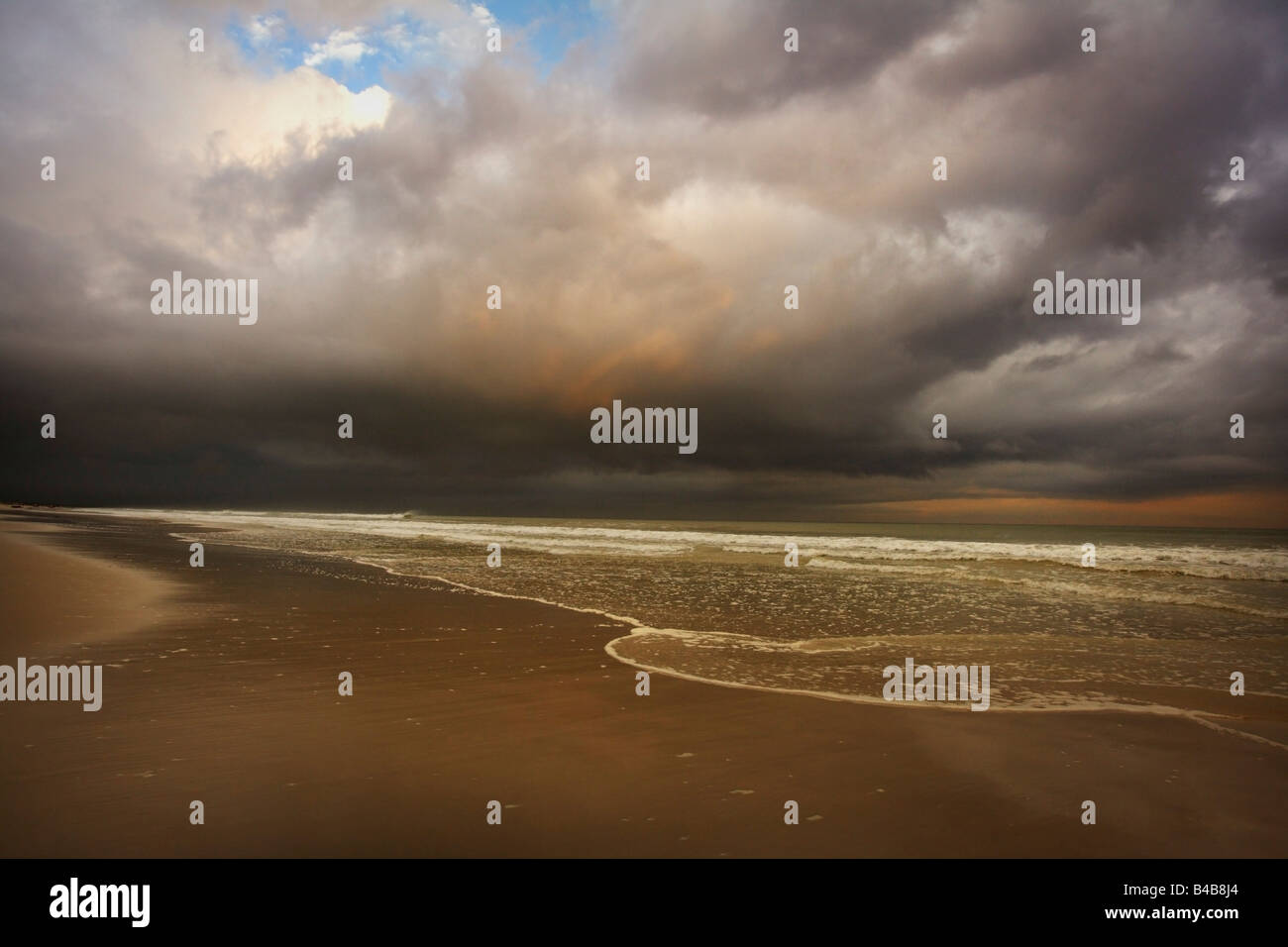 Storm clouds over beach Stock Photo - Alamy