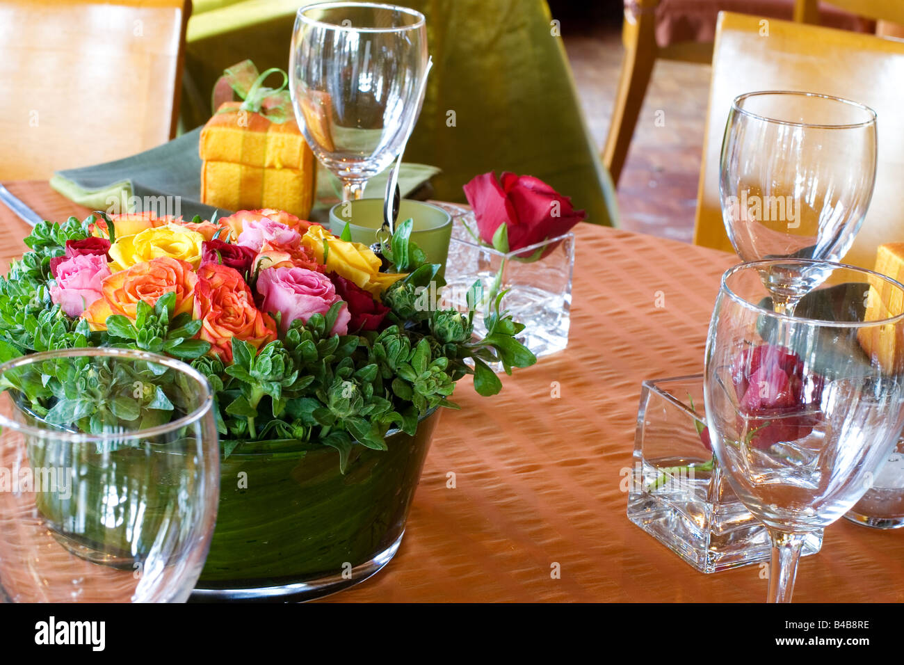 Table setting with gift Stock Photo - Alamy