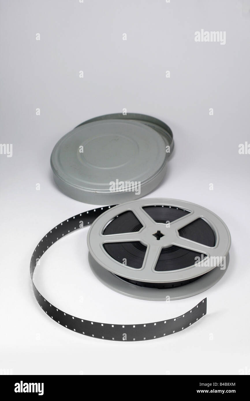 Reel of motion picture film with storage cans Stock Photo - Alamy