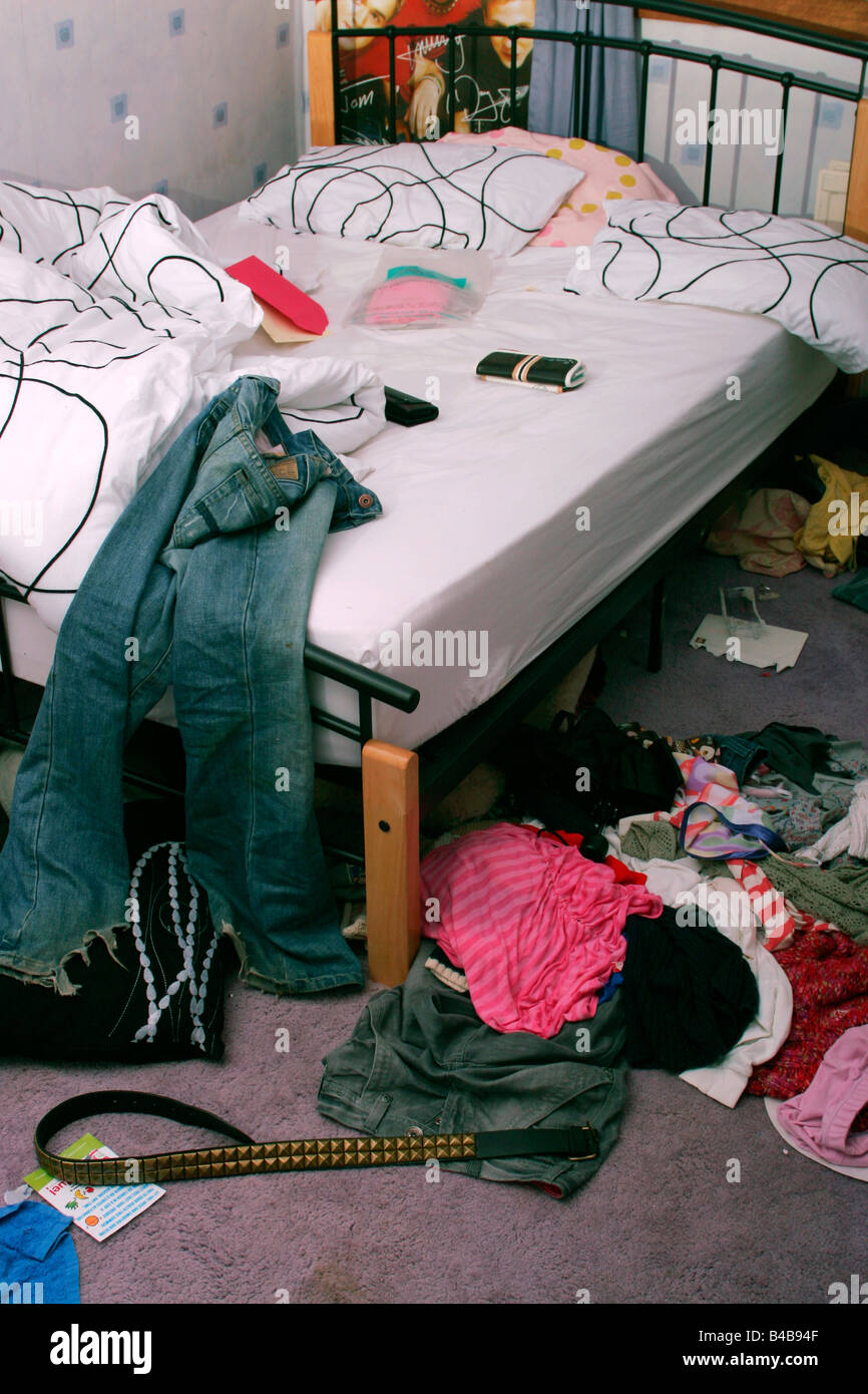 clothes on floor of messy teenagers bedroom Stock Photo - Alamy