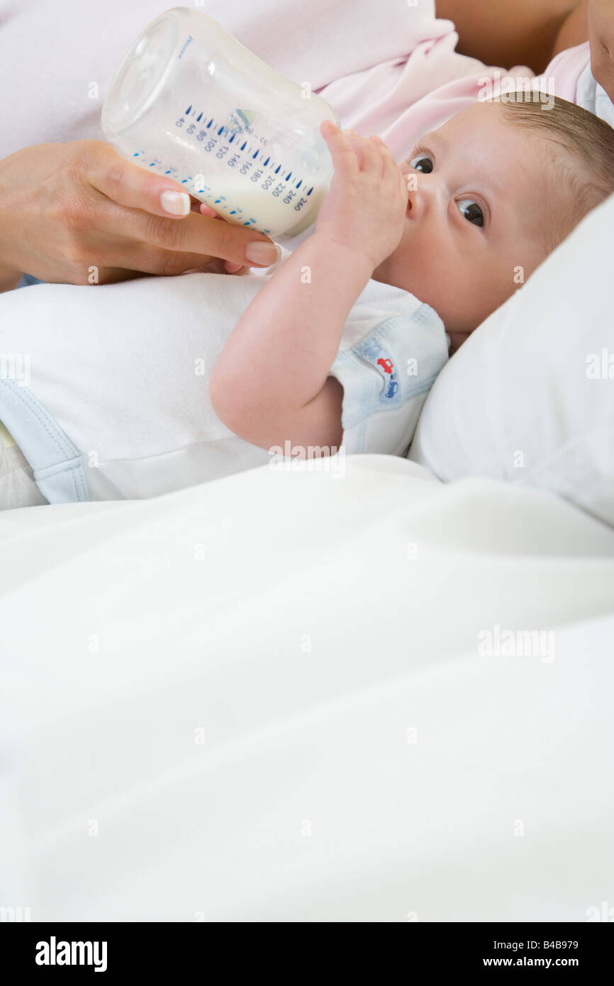 Woman passing baby over hi-res stock photography and images - Alamy
