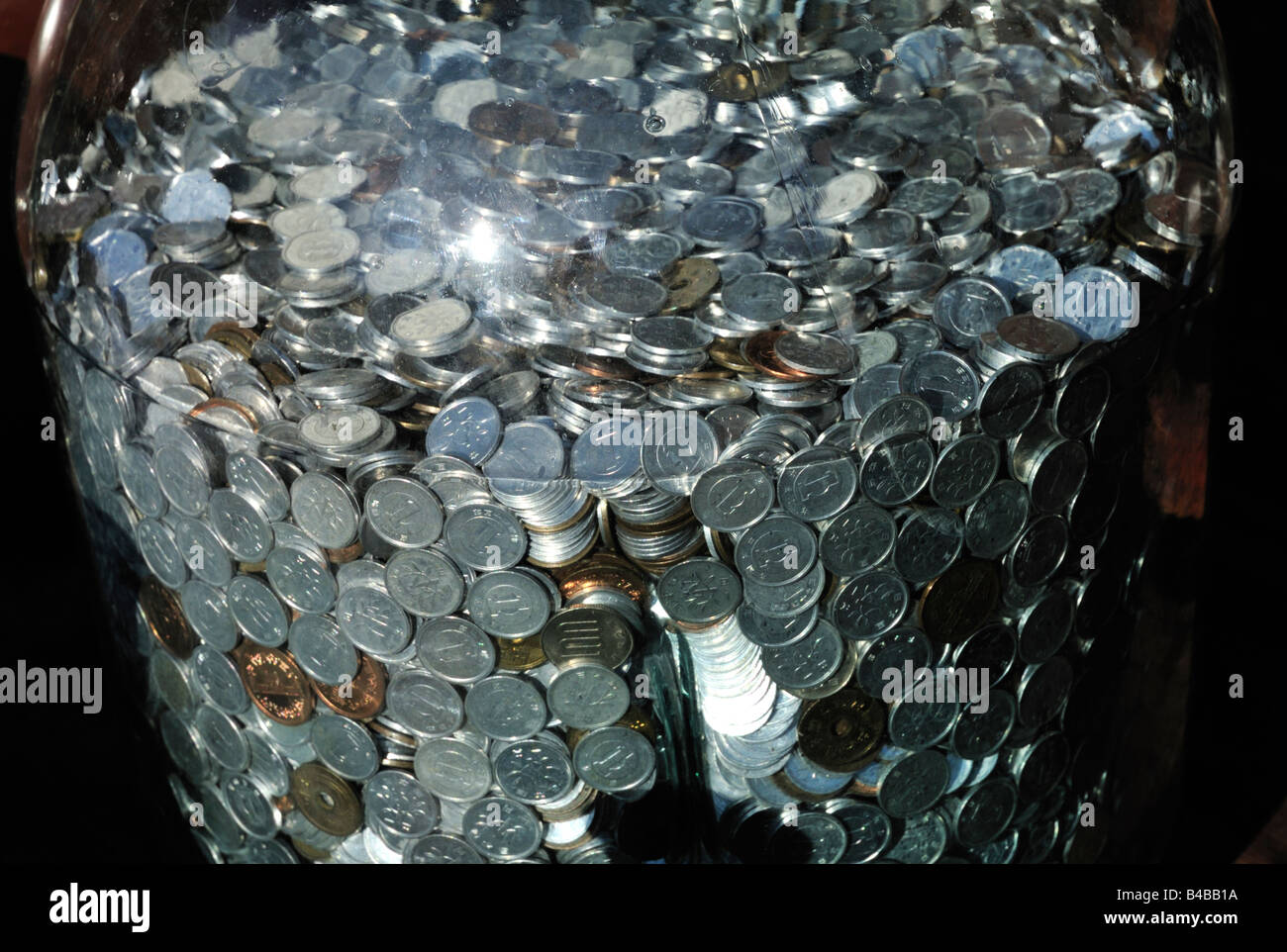 Japanese coins in a bottle Stock Photo - Alamy