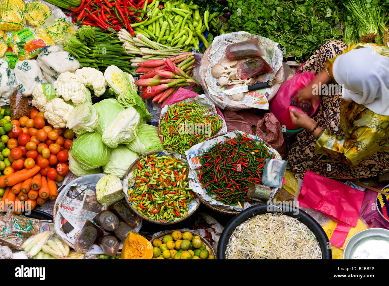 Asia, Malaysia, Kelantan State, Kota Bharu, women selling fruit and ...