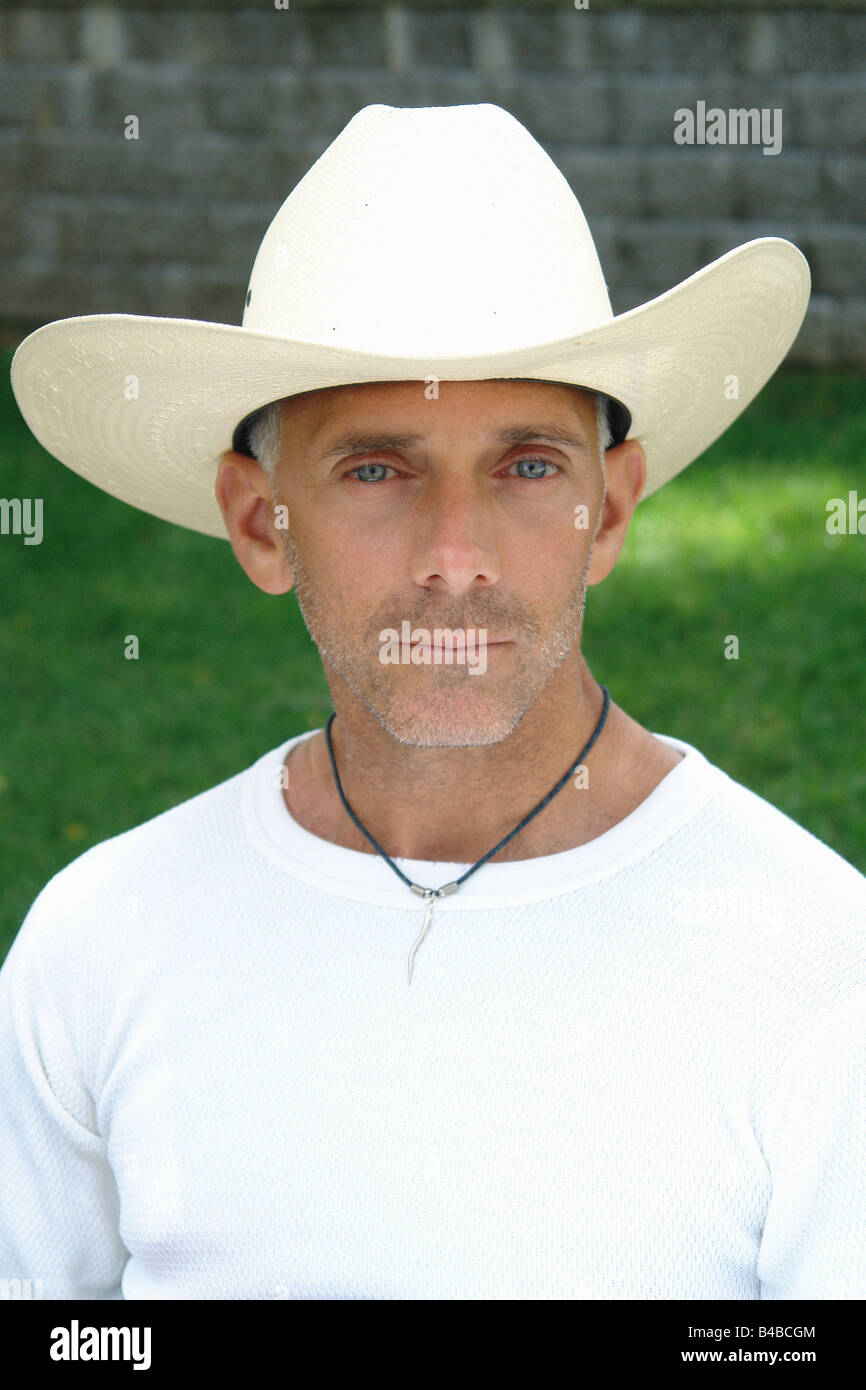Outdoor Portrait of an Shaven Baby Boomer Aged Man in a Cowboy Hat and ...