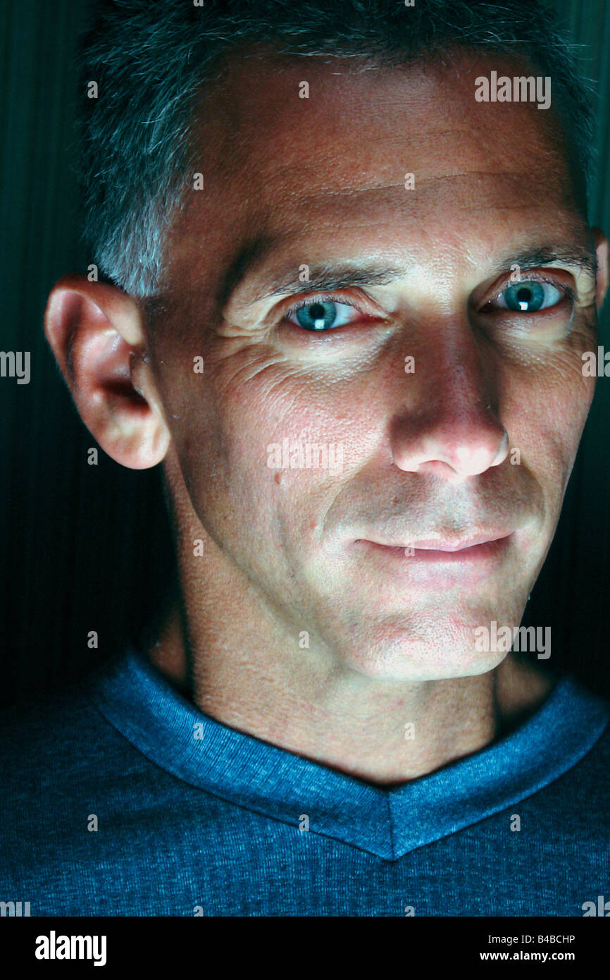 Dramatically Lit Closeup Studio Portrait of a Baby Boomer Aged Man with ...