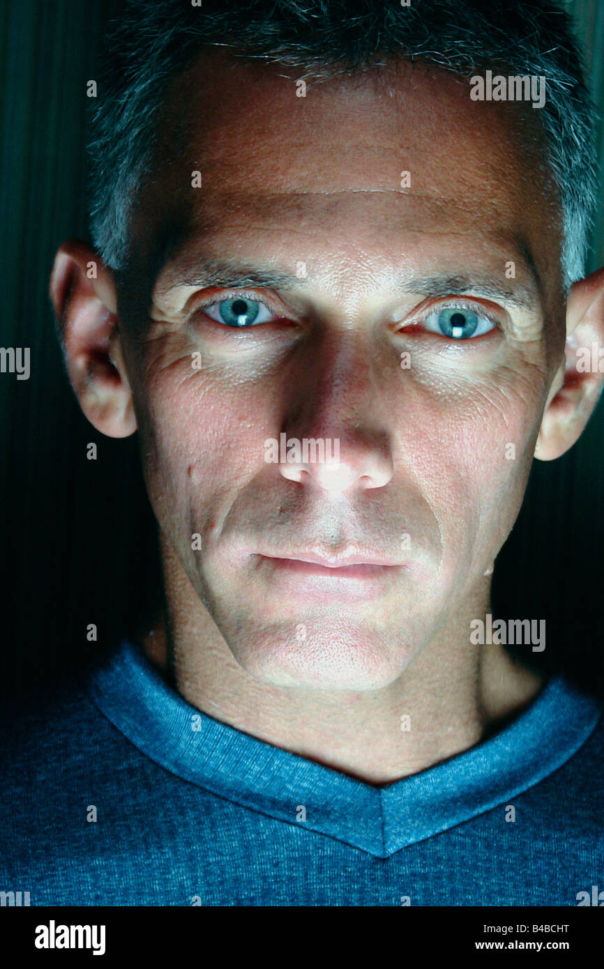 Dramatically Lit Closeup Studio Portrait of a Baby Boomer Aged Man with ...