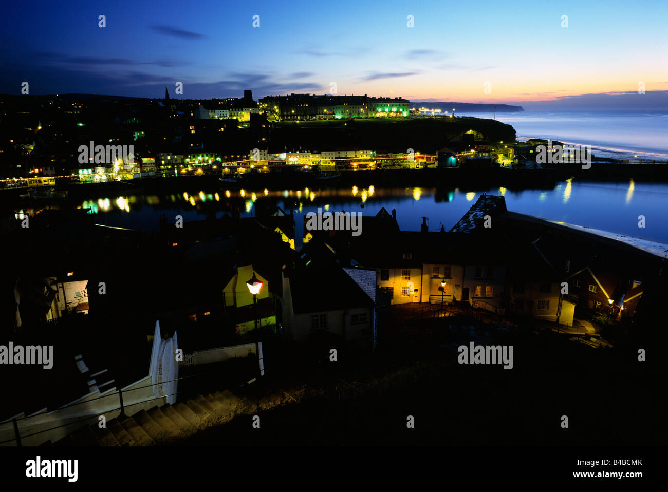A dusk view of Whitby Harbour Stock Photo - Alamy