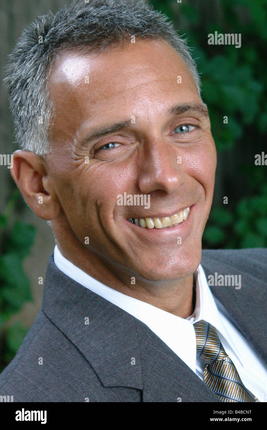 Casual Outdoor Portrait of a Smiling Baby Boomer Aged Businessman ...