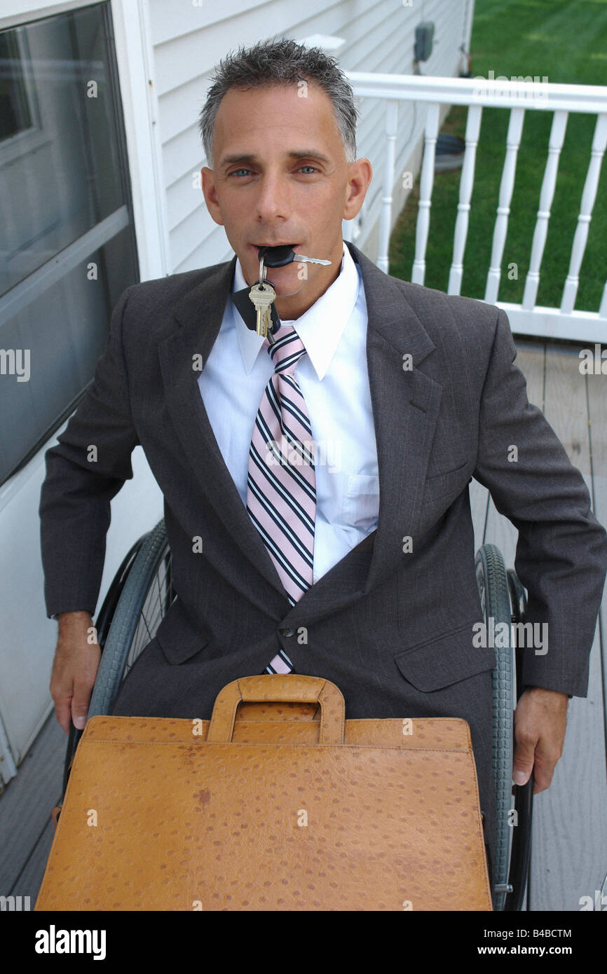 Portrait of a Baby Boomer Aged Businessman in a Wheelchair He is ...