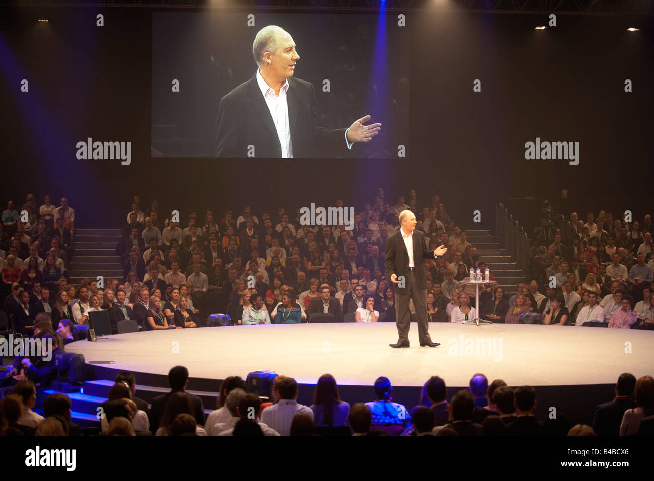 Employees listen to Managing Partner Scott Halliday at their corporate ...