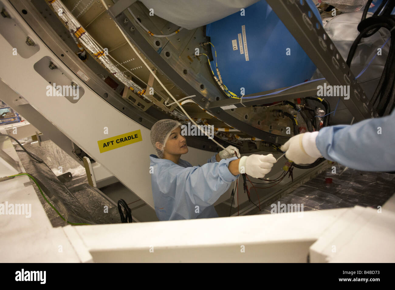 Lady technician constructs European Space Agency's Automated Transfer ...