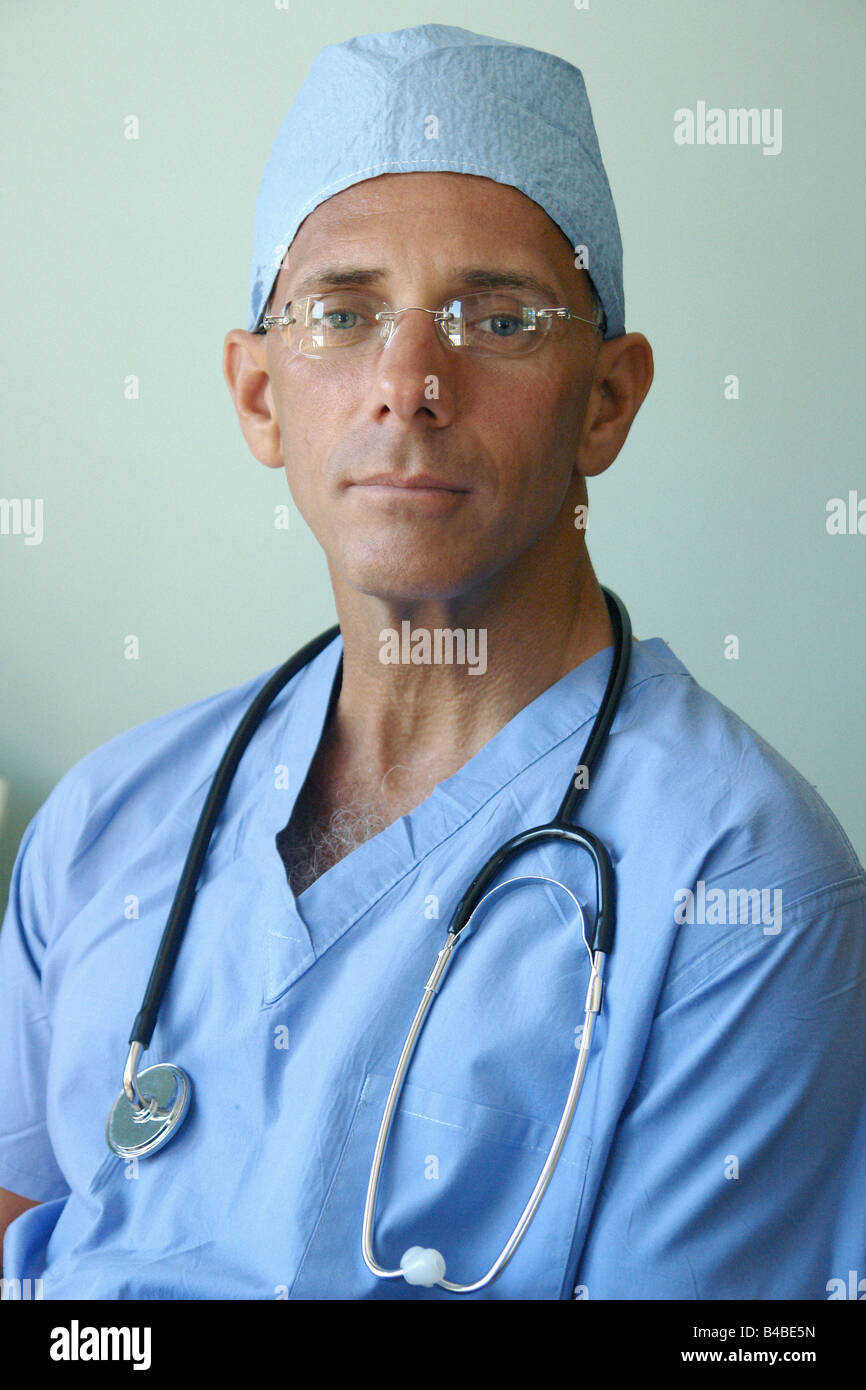 Portrait of a Male Doctor in Blue Surgical Scrubs He is Looking into ...