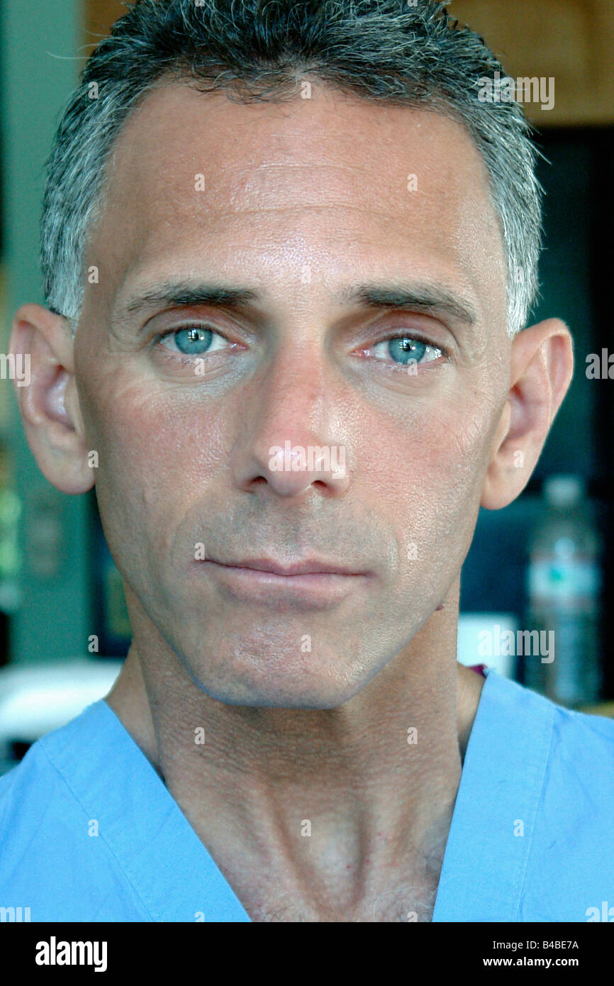 Closeup Portrait of a Male Doctor in Blue Surgical Scrubs He is Looking ...