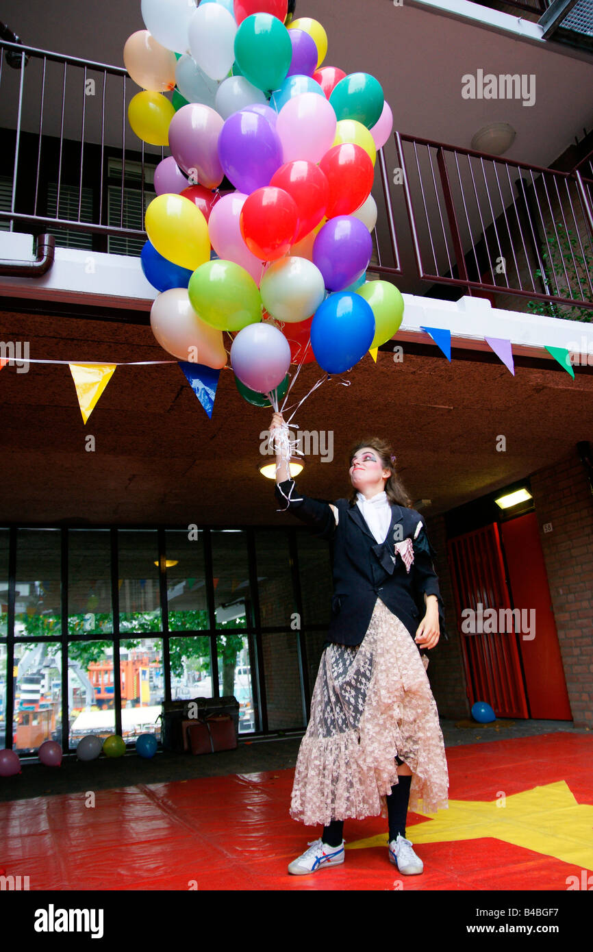 Woman standing with many inflatable floating balloons bunch colorful ...