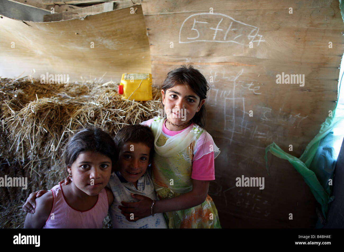 Roma gypsy children in their home at Share, a slum next to a rubbish ...