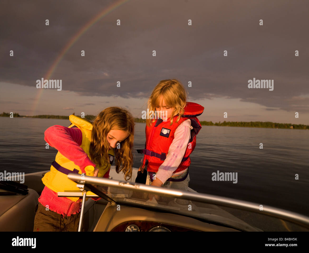 Two girls on a boat Stock Photo - Alamy