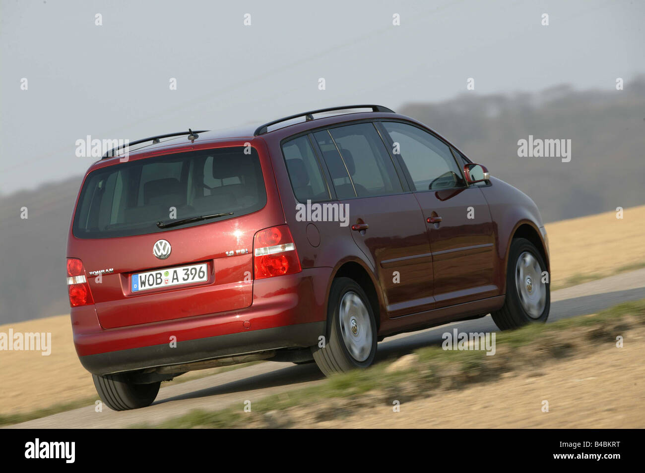 Car, VW Volkswagen Touran, Van, model year 2003-, red, driving ...