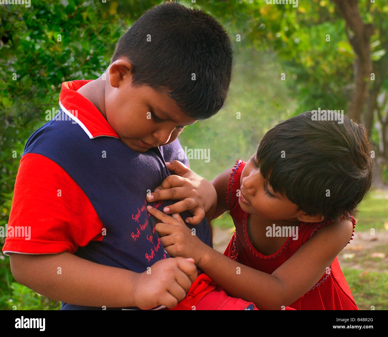 sister checks bro Stock Photo - Alamy