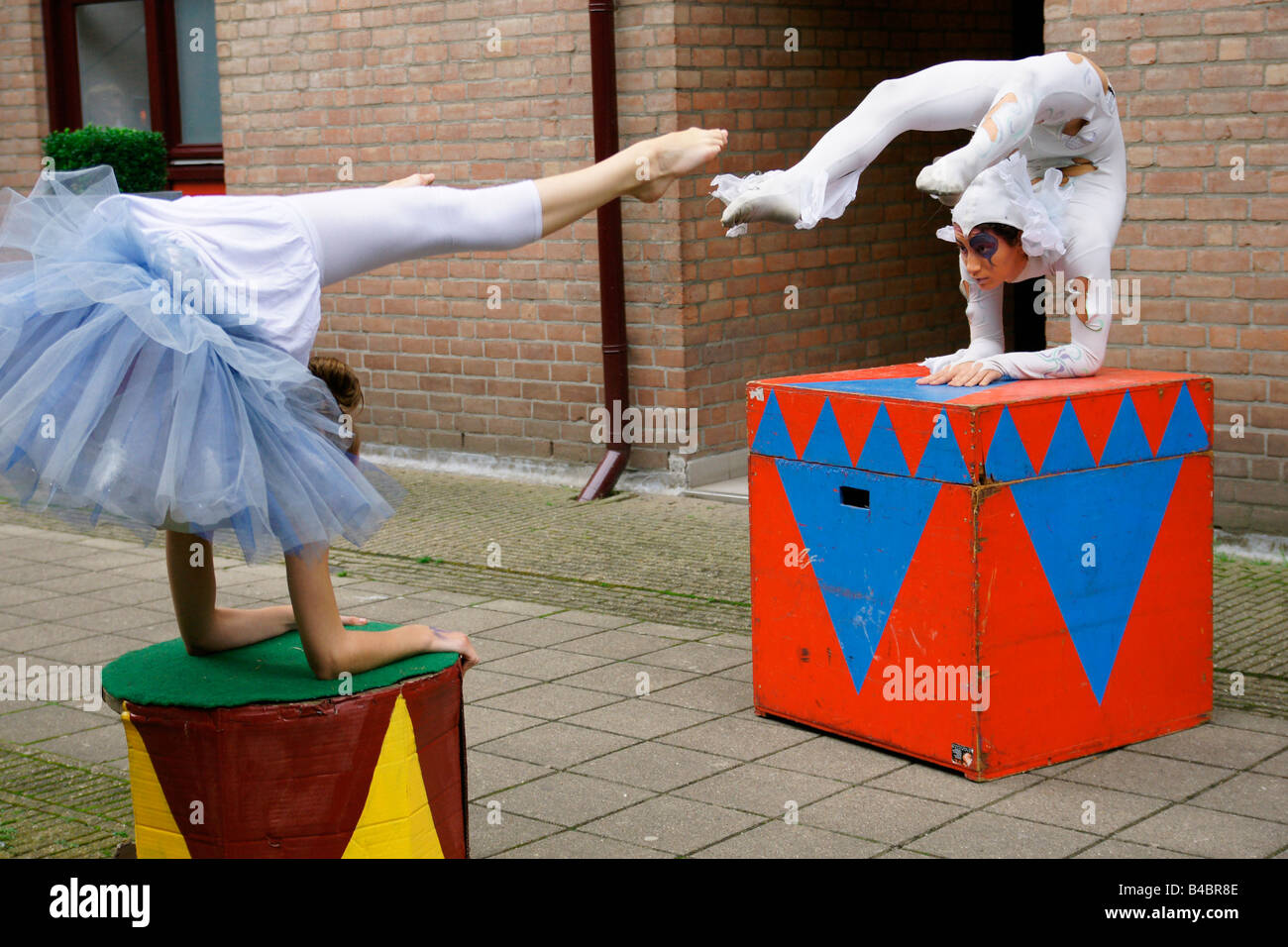Italian young flexible women contortionist clown performing show bent ...