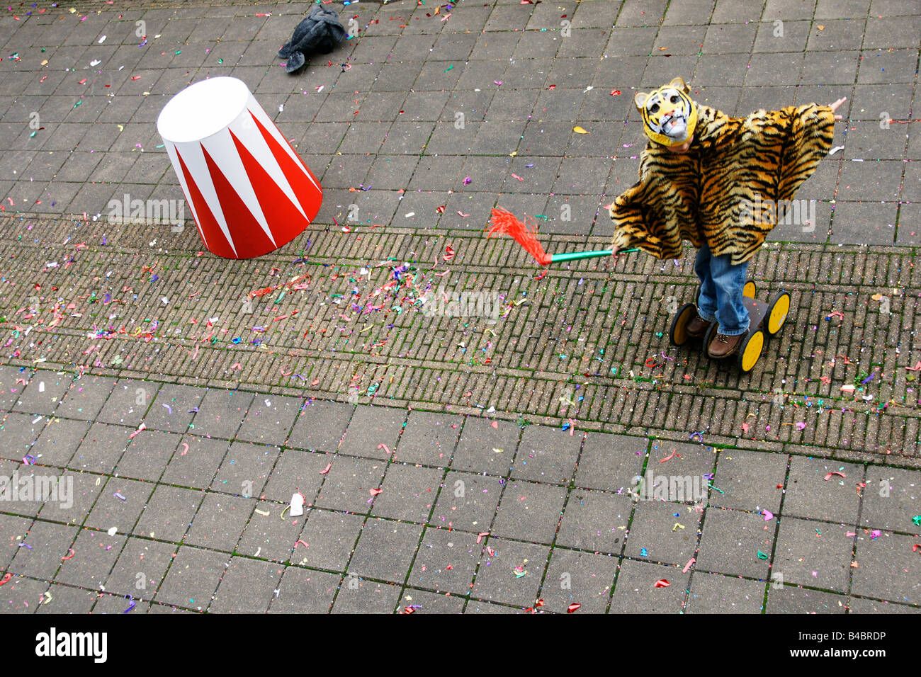 One child clown wearing tiger skin mask circus entertainment outdoors ...