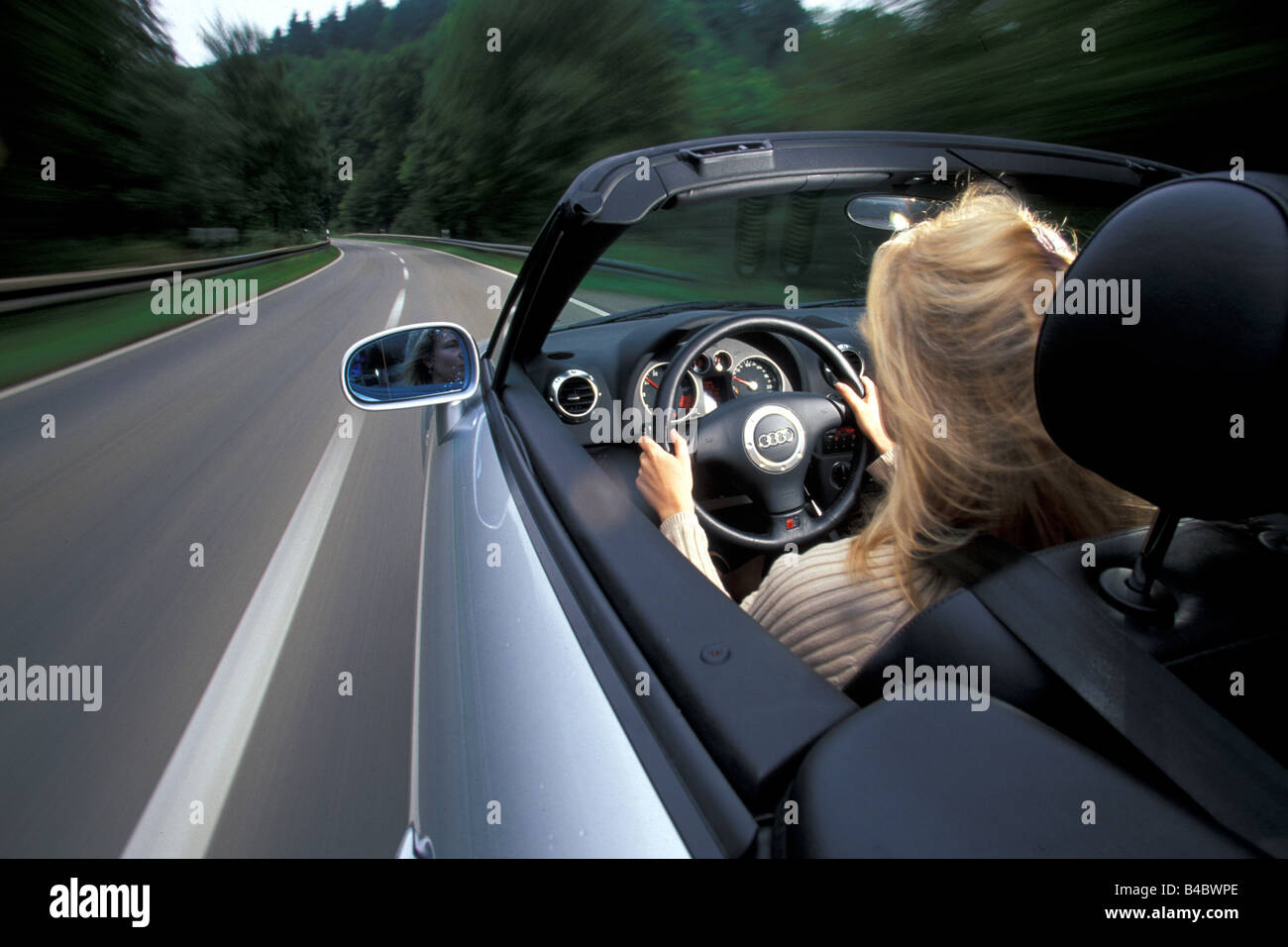 Car, Woman and approx., Woman in convertible, driving, interior view ...