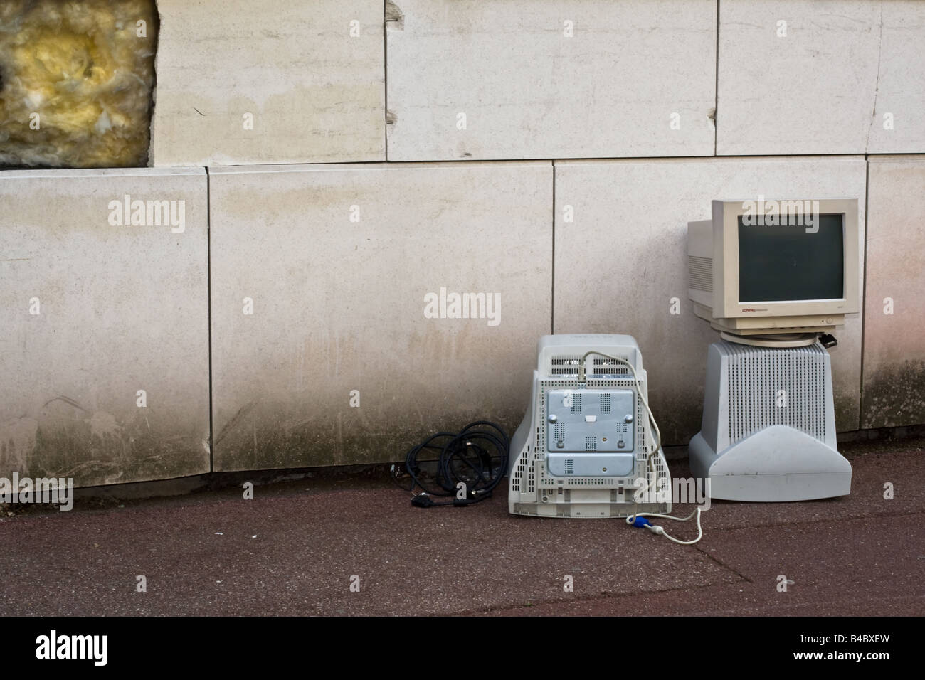 Three old obsolete computer screen monitors discarded as junk on the ...