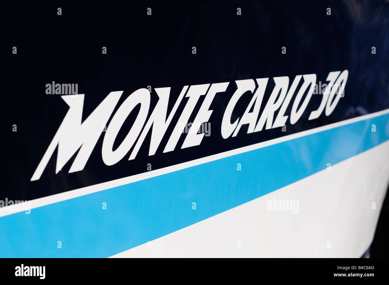 Signage on the side of a speed boat that reads Monte Carlo 30. Picture ...