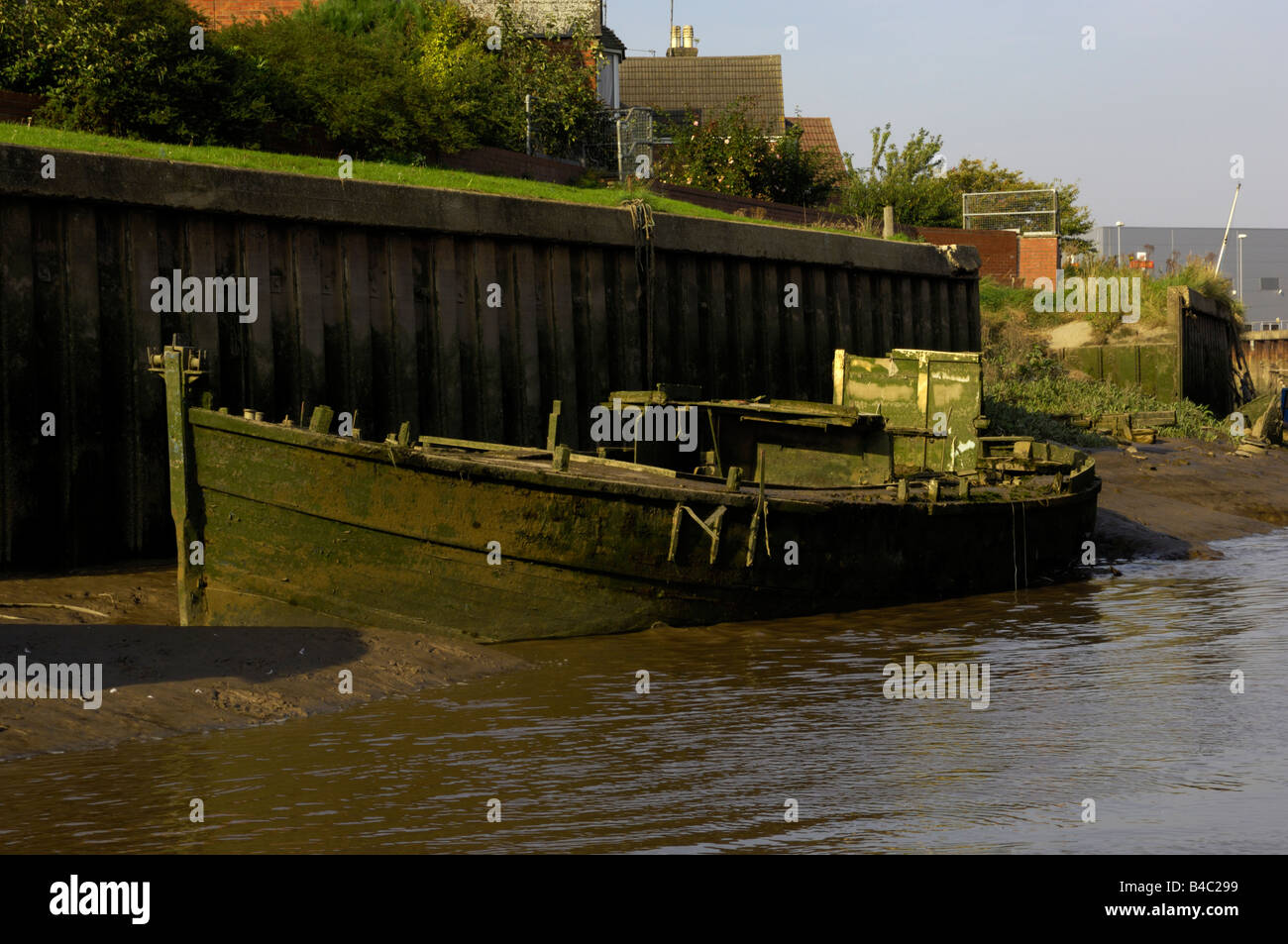 Old wooden boat buried in the mud on the River Witham at Boston ...