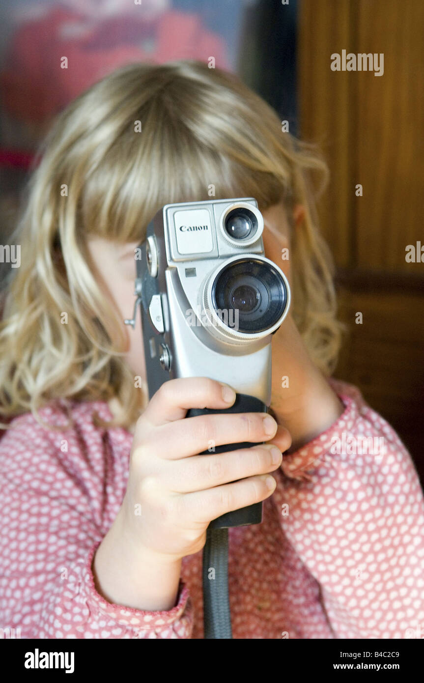 Little girl holding a video camera Stock Photo - Alamy