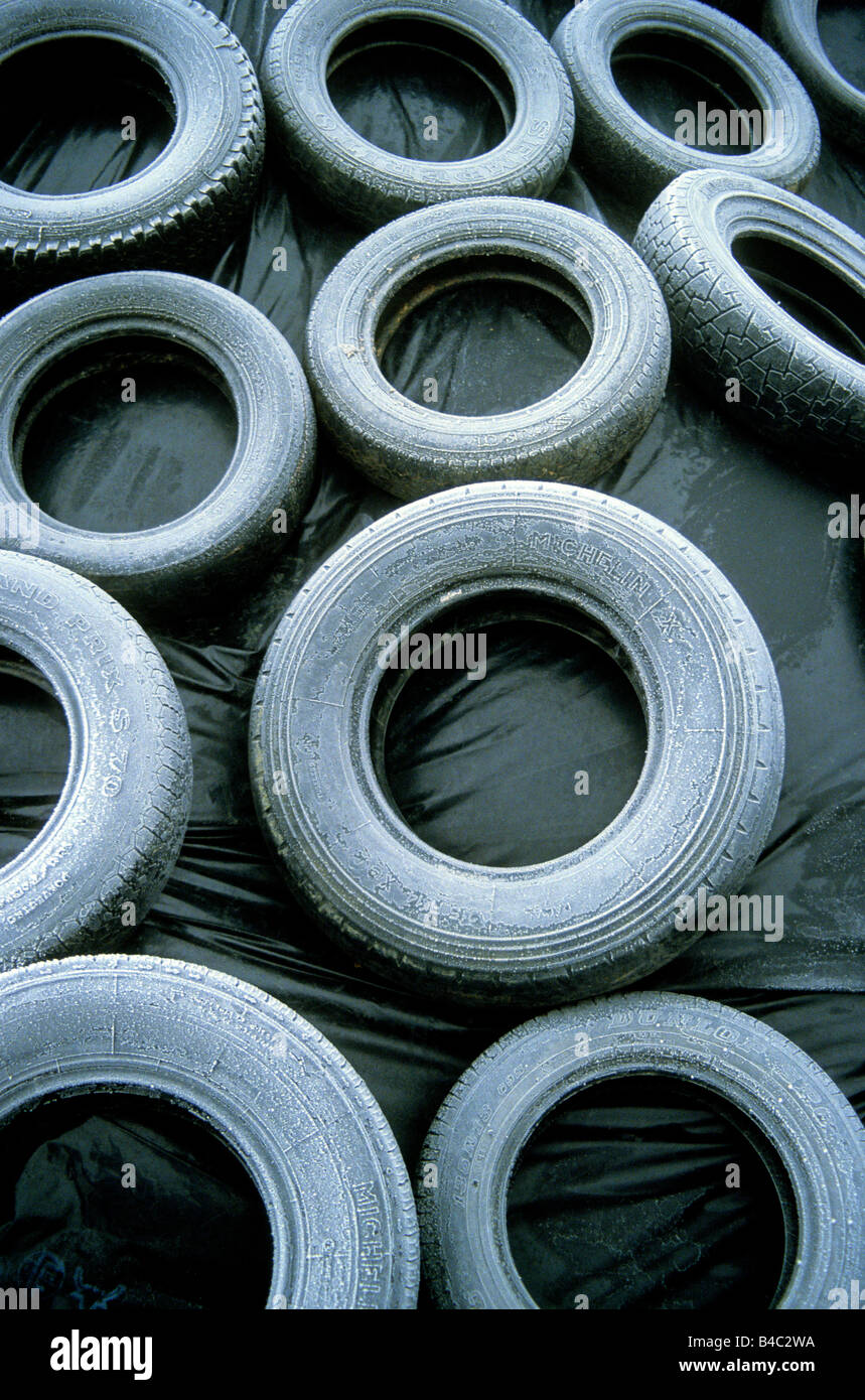 Old rubber tyres in the countryside Stock Photo - Alamy