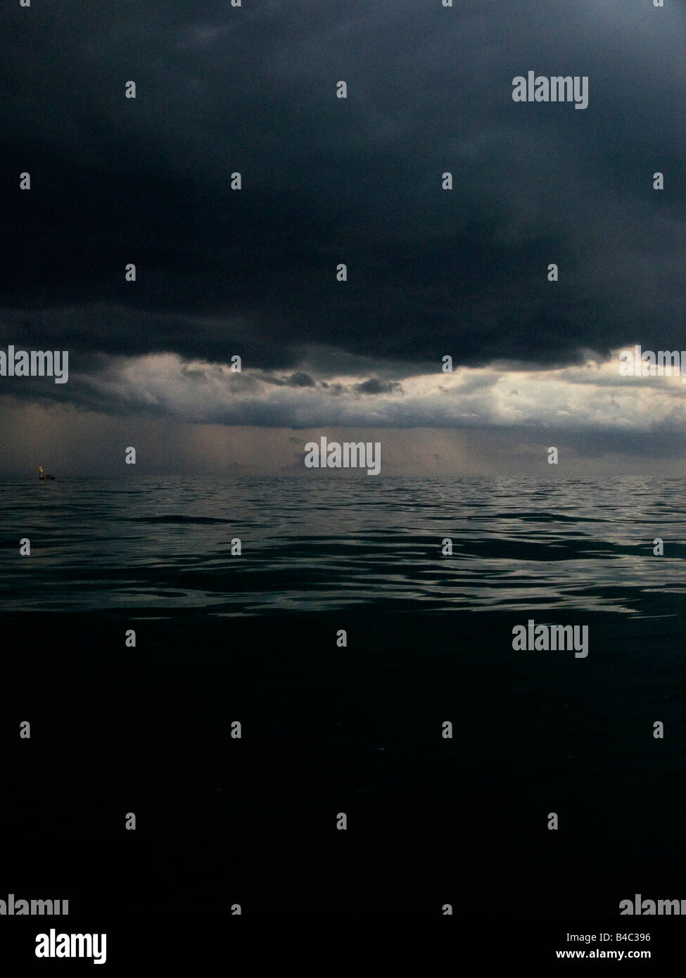 Grey clouds over the sea hi-res stock photography and images - Alamy