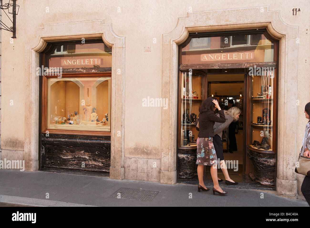 Two women looking at a shop window at Via Condotti Rome Italy Stock ...