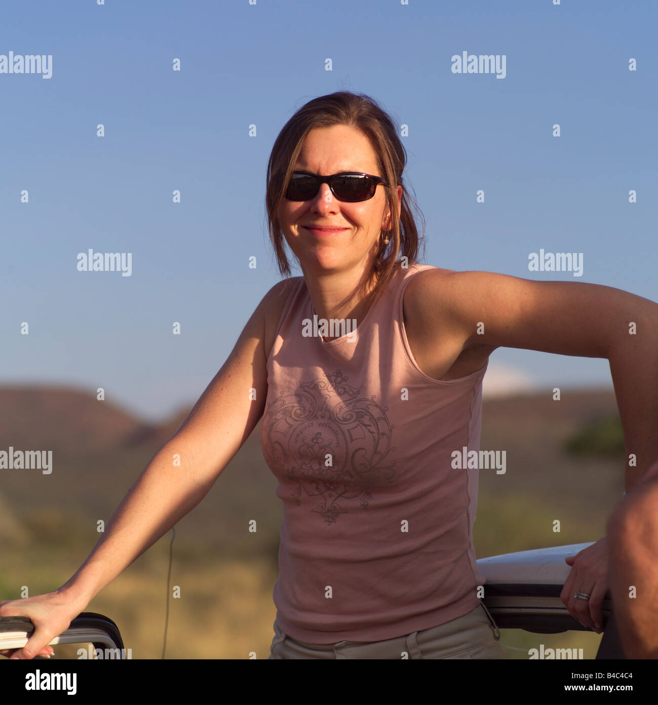 Portrait of woman in the sun Stock Photo - Alamy