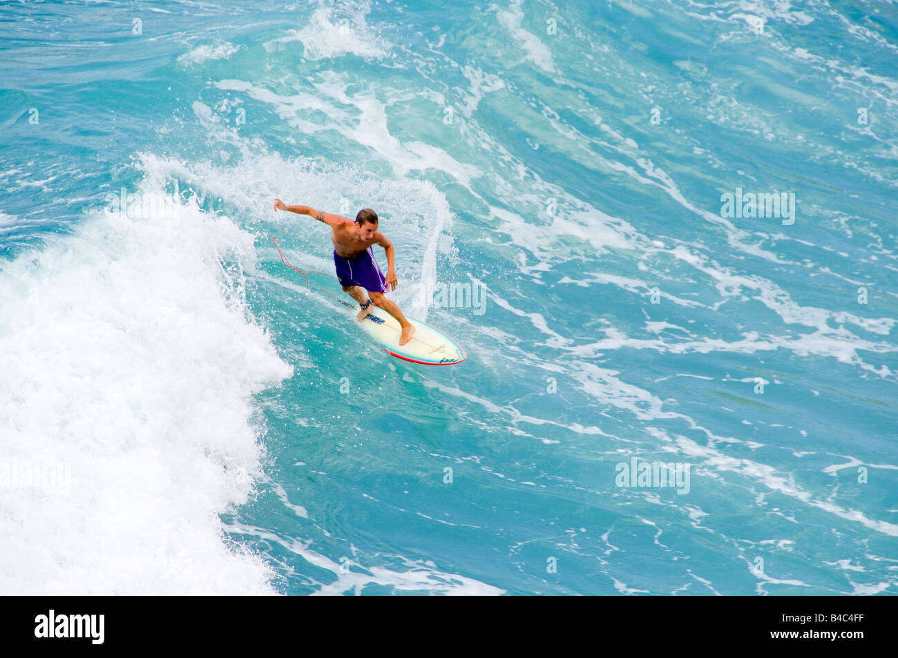 Male surfer in the water surfing Stock Photo - Alamy
