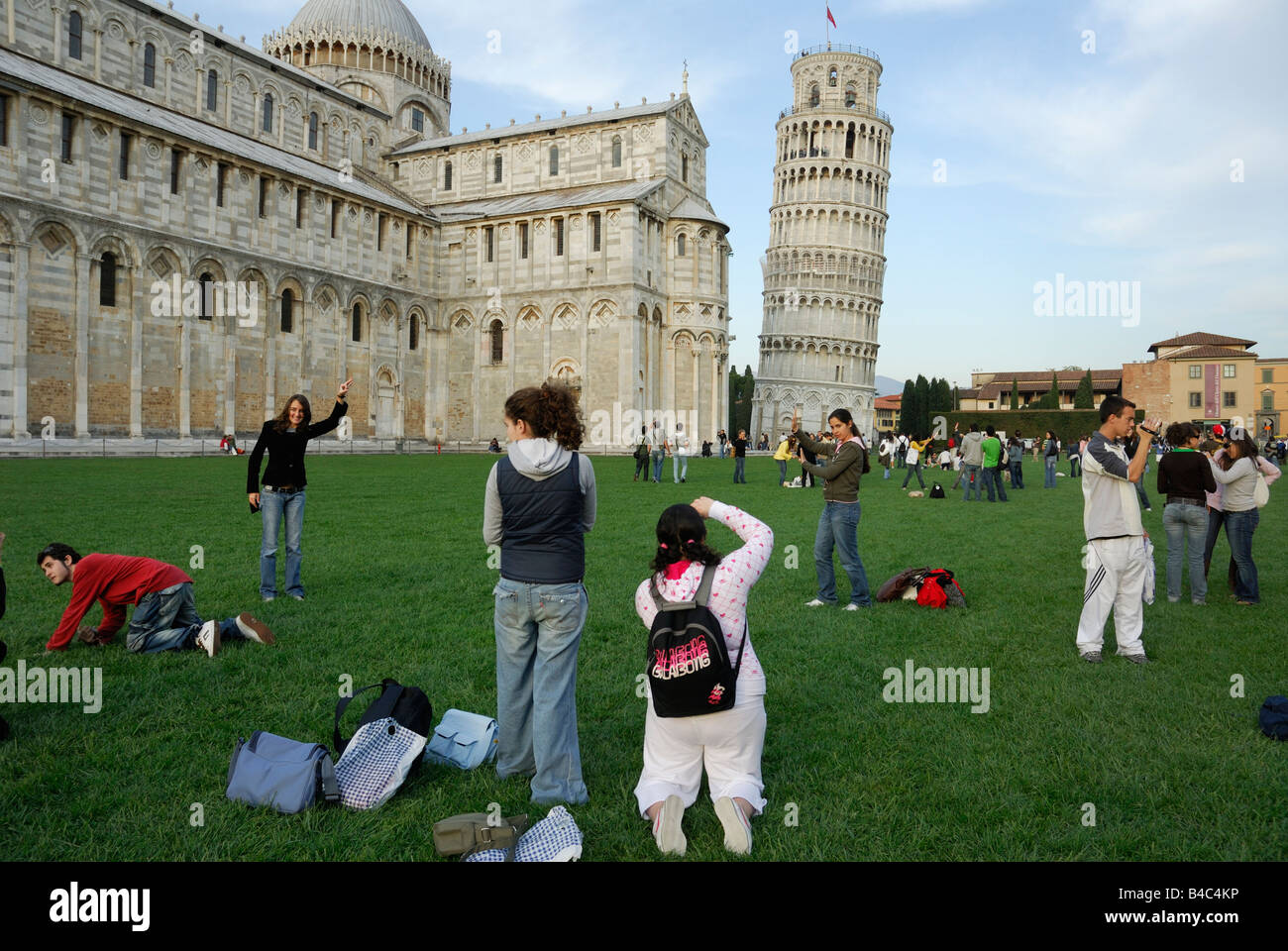 Pisa Italy Tourists photograph one another infront of the Leaning Tower ...